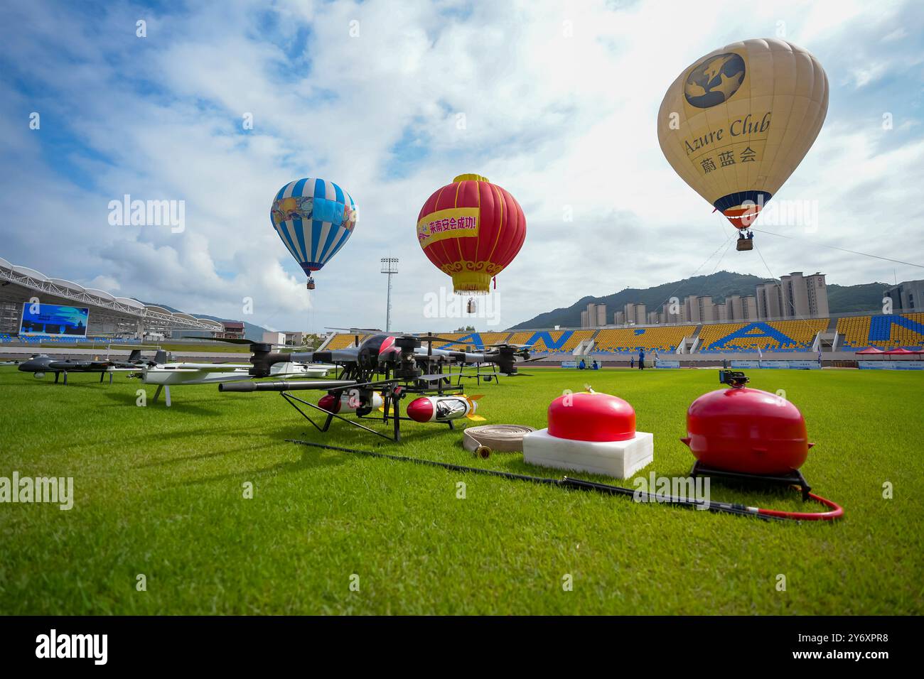 NAN'AN, CHINA - SEPTEMBER 27, 2024 - Hot air balloons and drones are ...