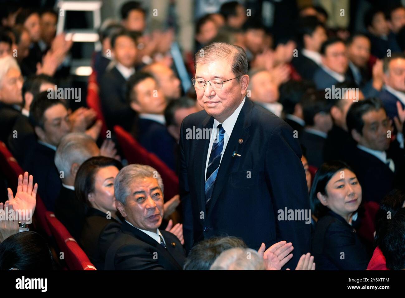 Shigeru Ishiba, center, acknowledges after he was elected as new head ...