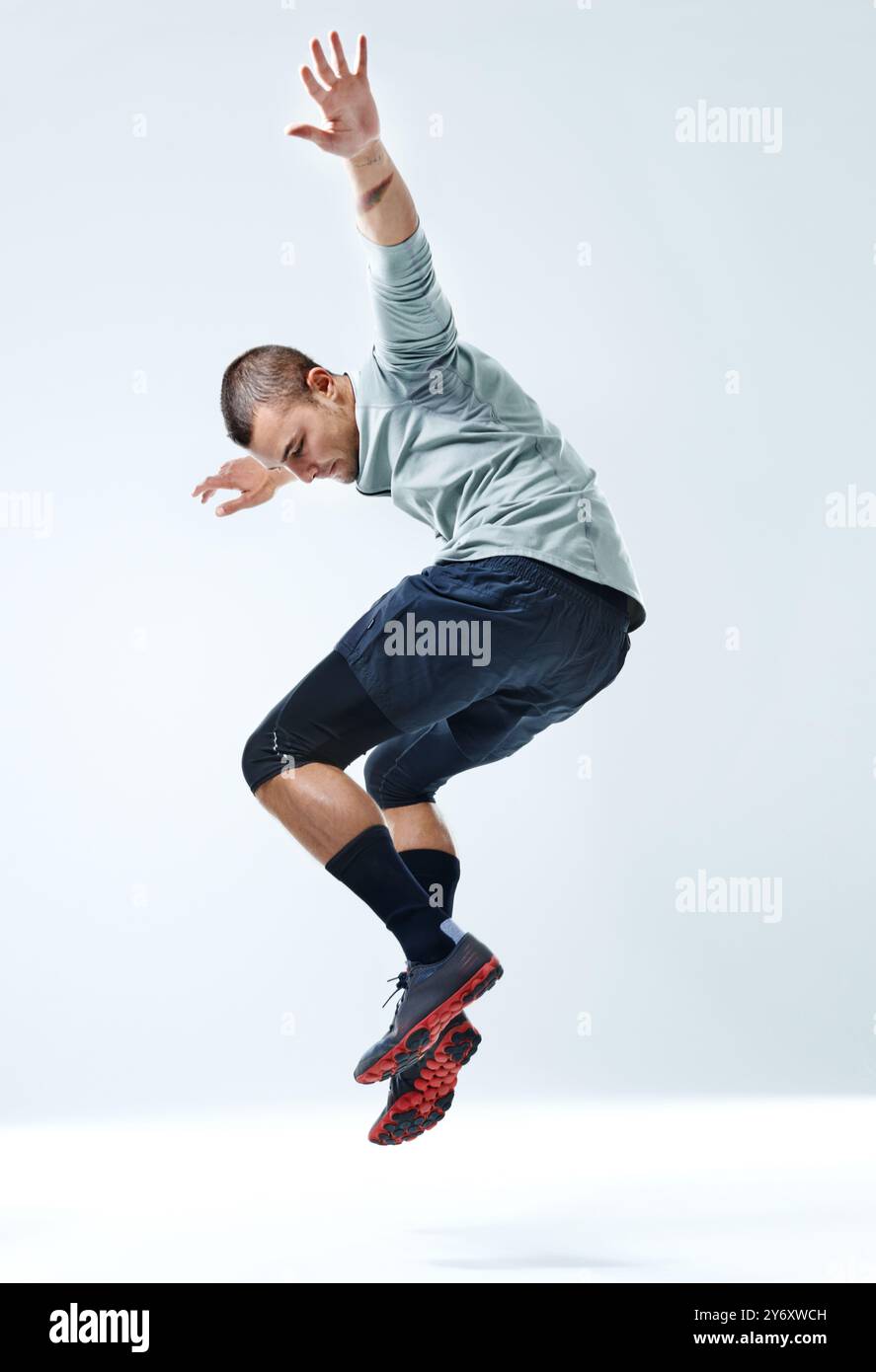 Fitness, man and jump with exercise in studio for healthy body, workout ...