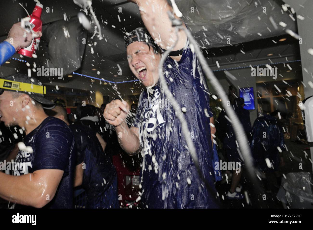 Los Angeles Dodgers slugger Shohei Ohtani gets drenched during a clubhouse celebration after ...