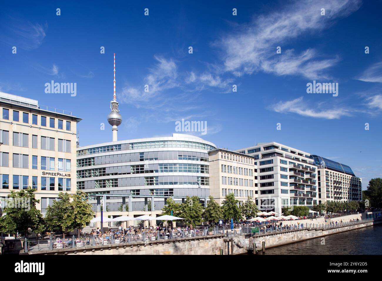 Contemporary buildings line the East bank of the Spree river ...
