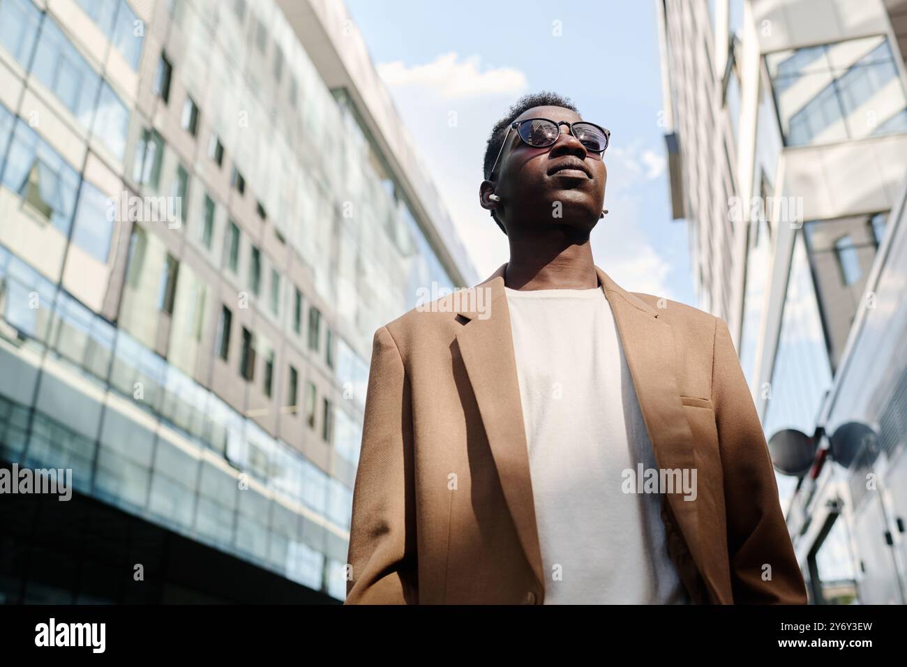 Young stylish businessman walking along hi-res stock photography and ...