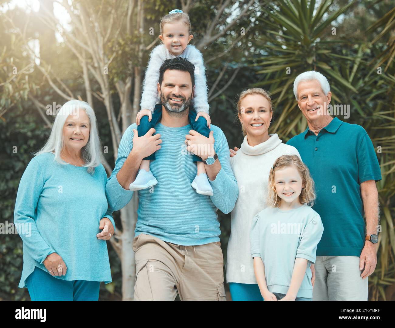 Big family, children and parents piggyback in garden with games, fun ...