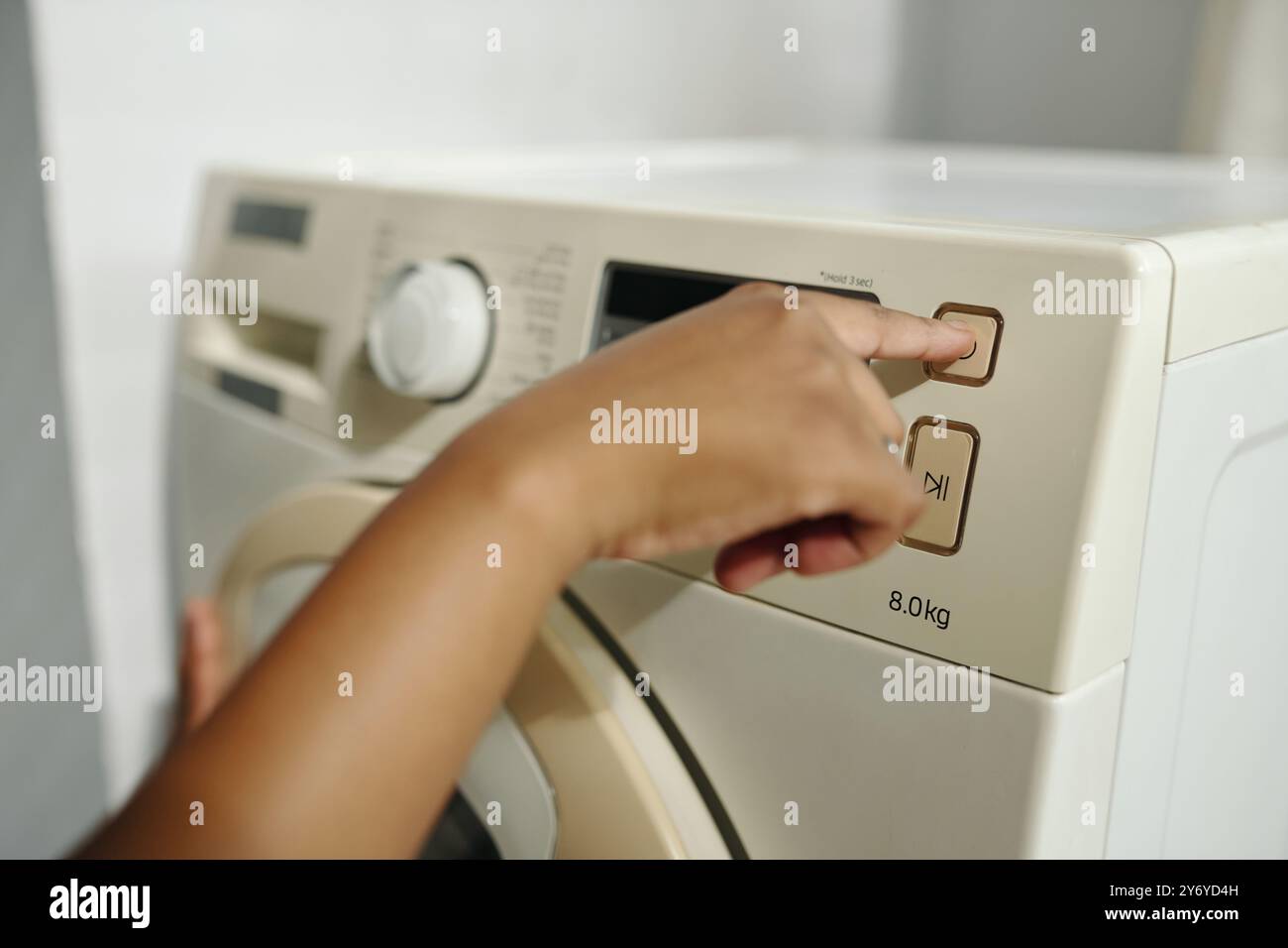Adjusting Settings on Modern Washing Machine Stock Photo - Alamy