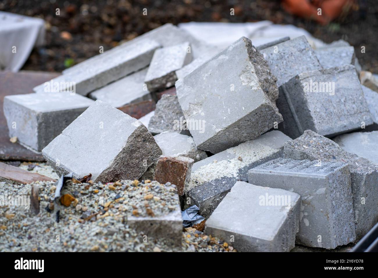 A mountain of rubble and the remains of old paving stones at a ...