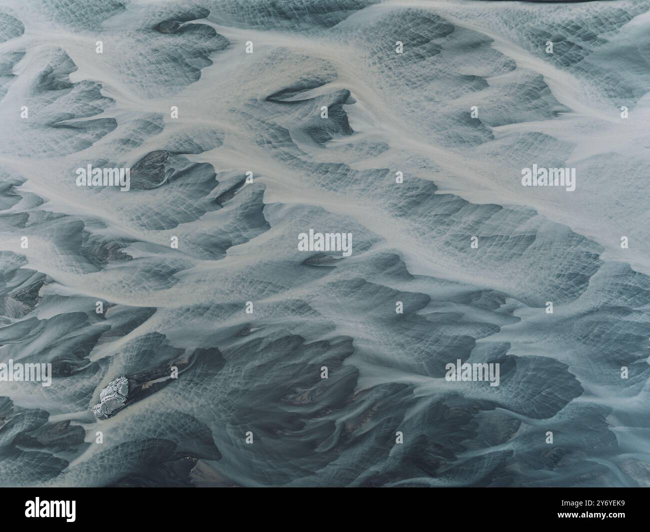 Aerial view of braided river patterns in Iceland, showcasing the ...
