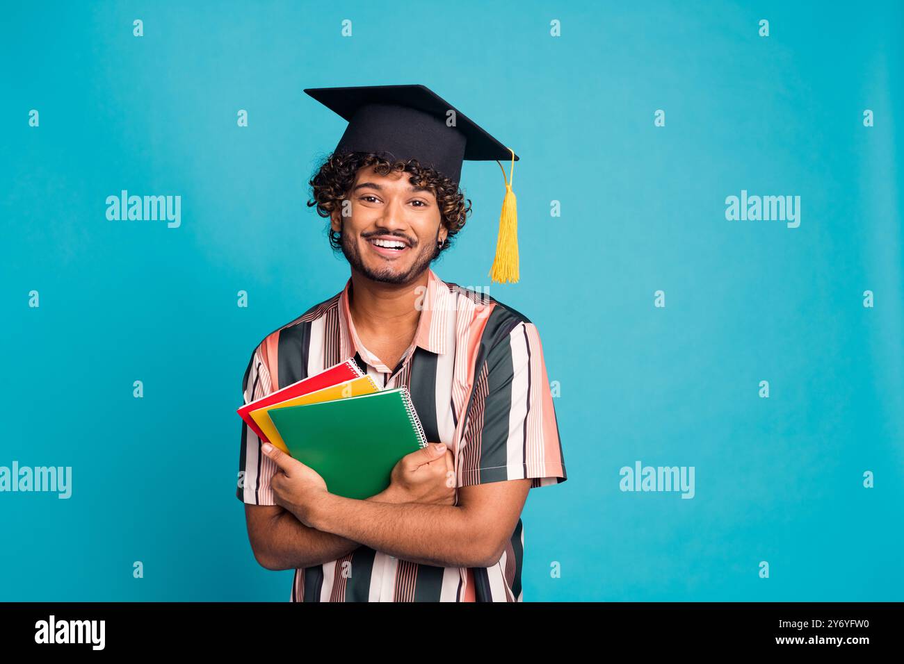 Photo of handsome good mood guy wear striped shirt mortarboard finish ...
