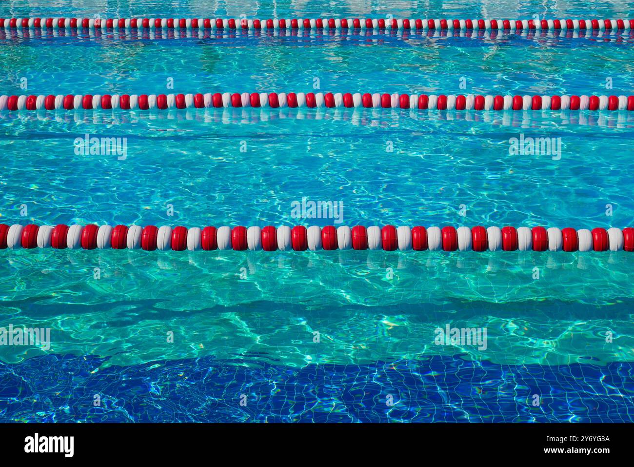 Swimming pool, swimming lanes separated by floats. Water surface in the ...