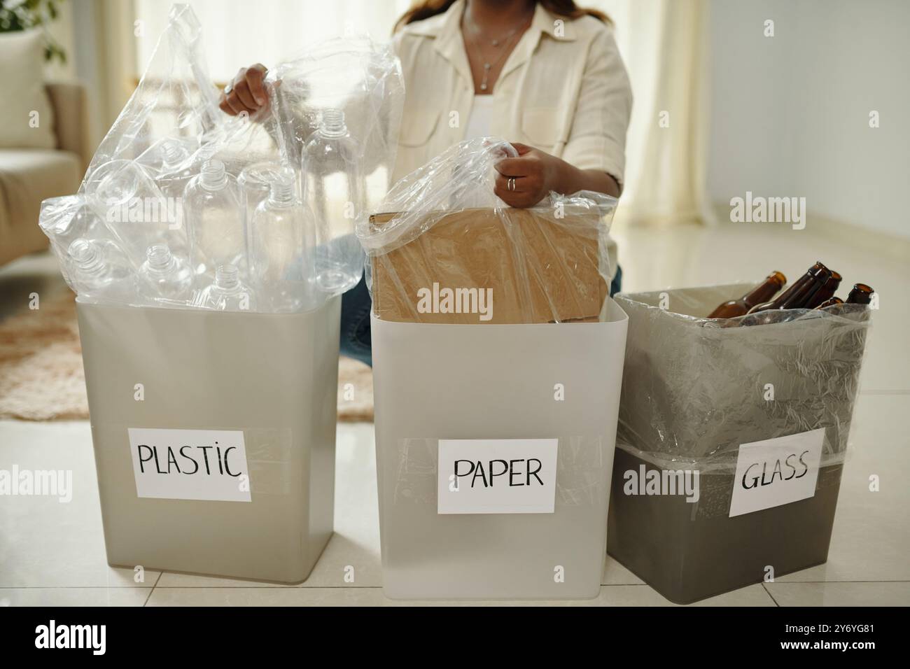 Sorting Recyclable Materials into Different Bins Stock Photo - Alamy