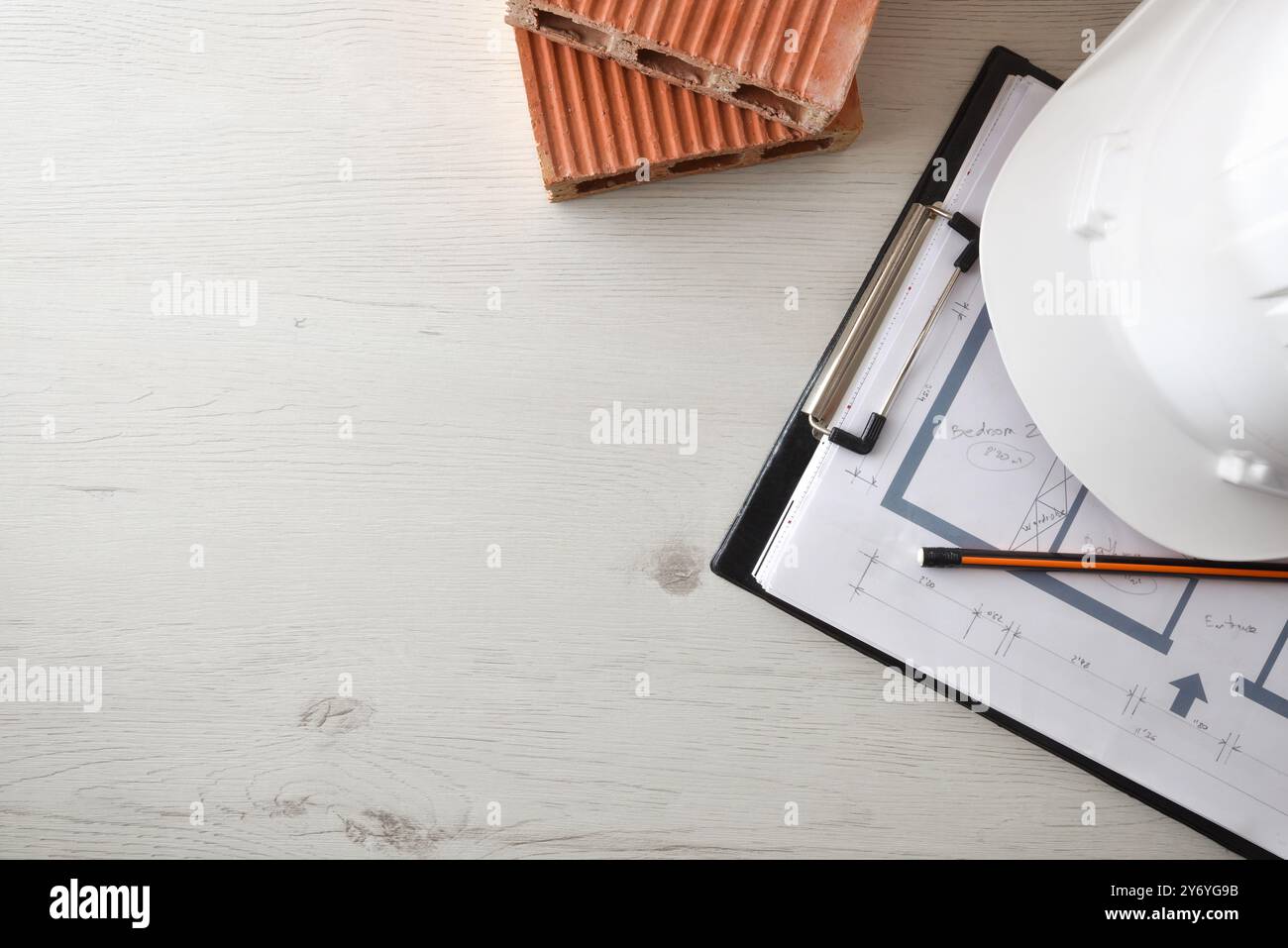 Conceptual background of architect's table with house plan with notes ...