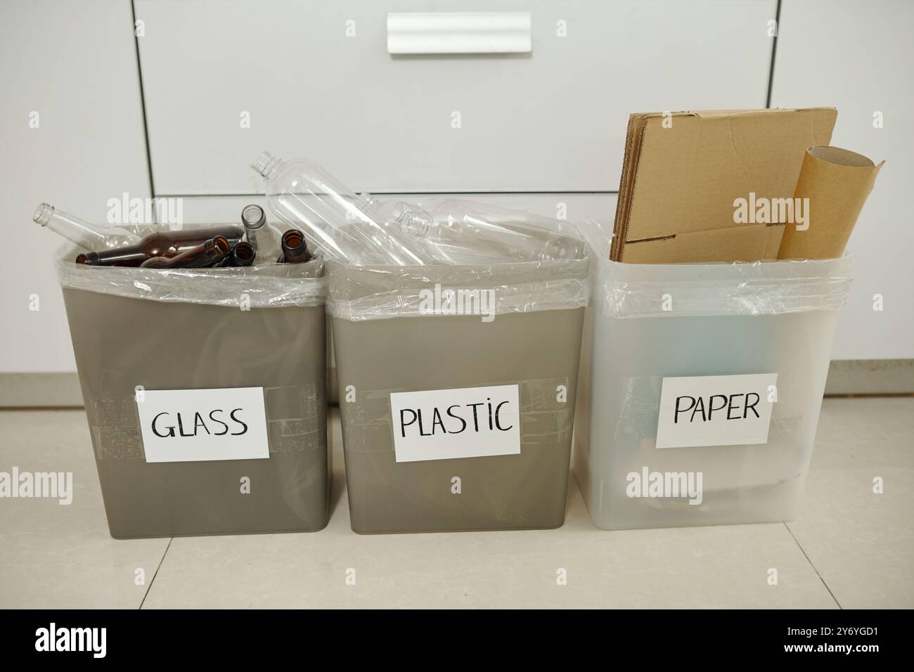Organizing Recycling Bins for Glass Plastic and Paper Waste Stock Photo ...
