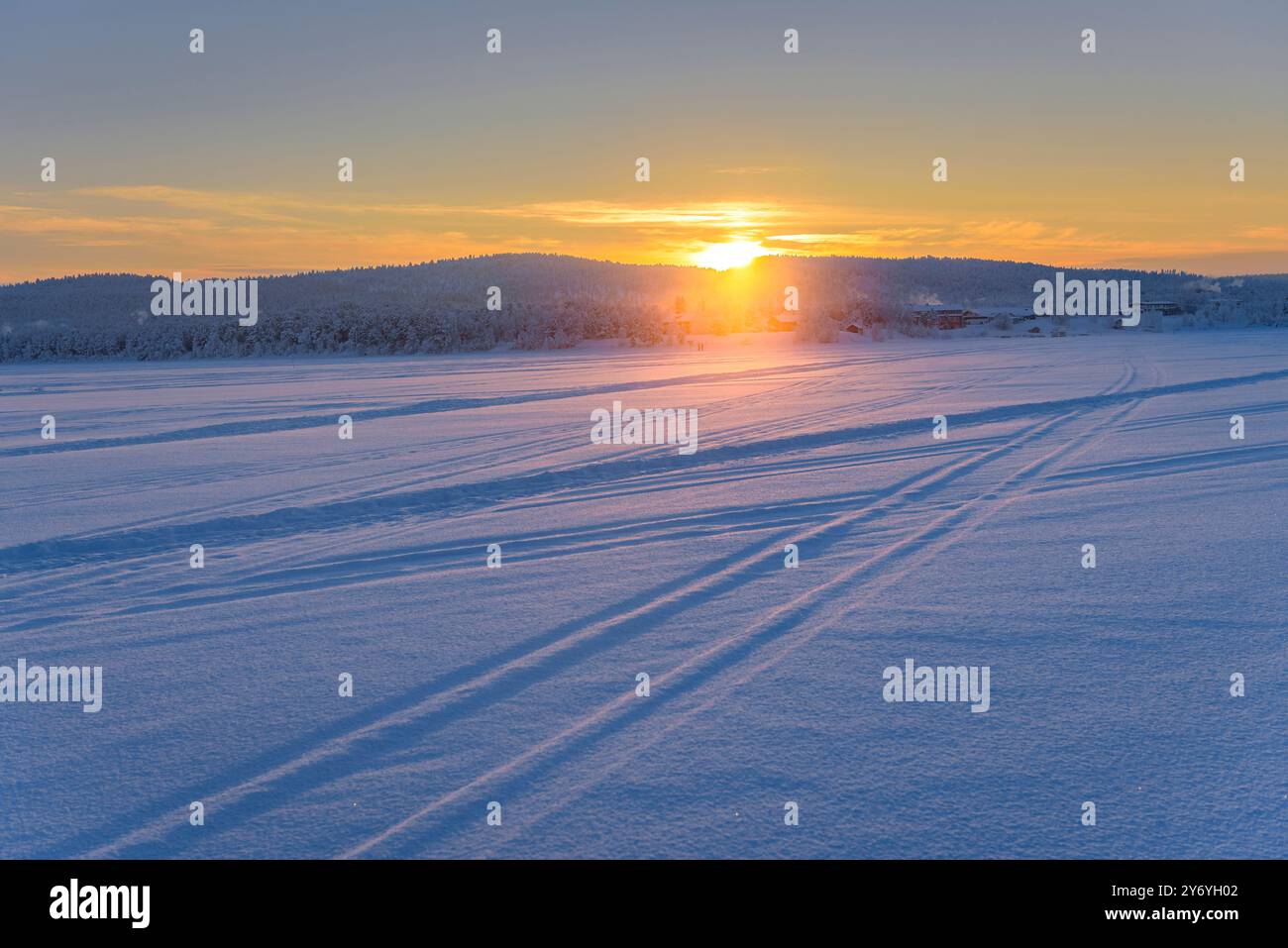 Frozen and snowy Lake Inari in winter, seen at sunset (Lapland, Finland ...