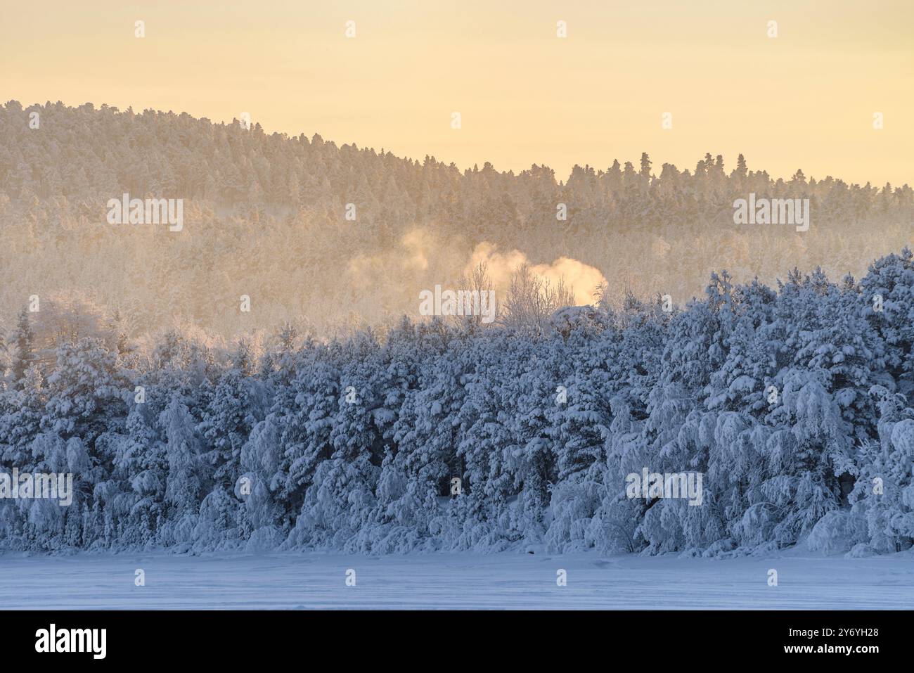 Frozen and snowy Lake Inari in winter, seen at sunset (Lapland, Finland ...