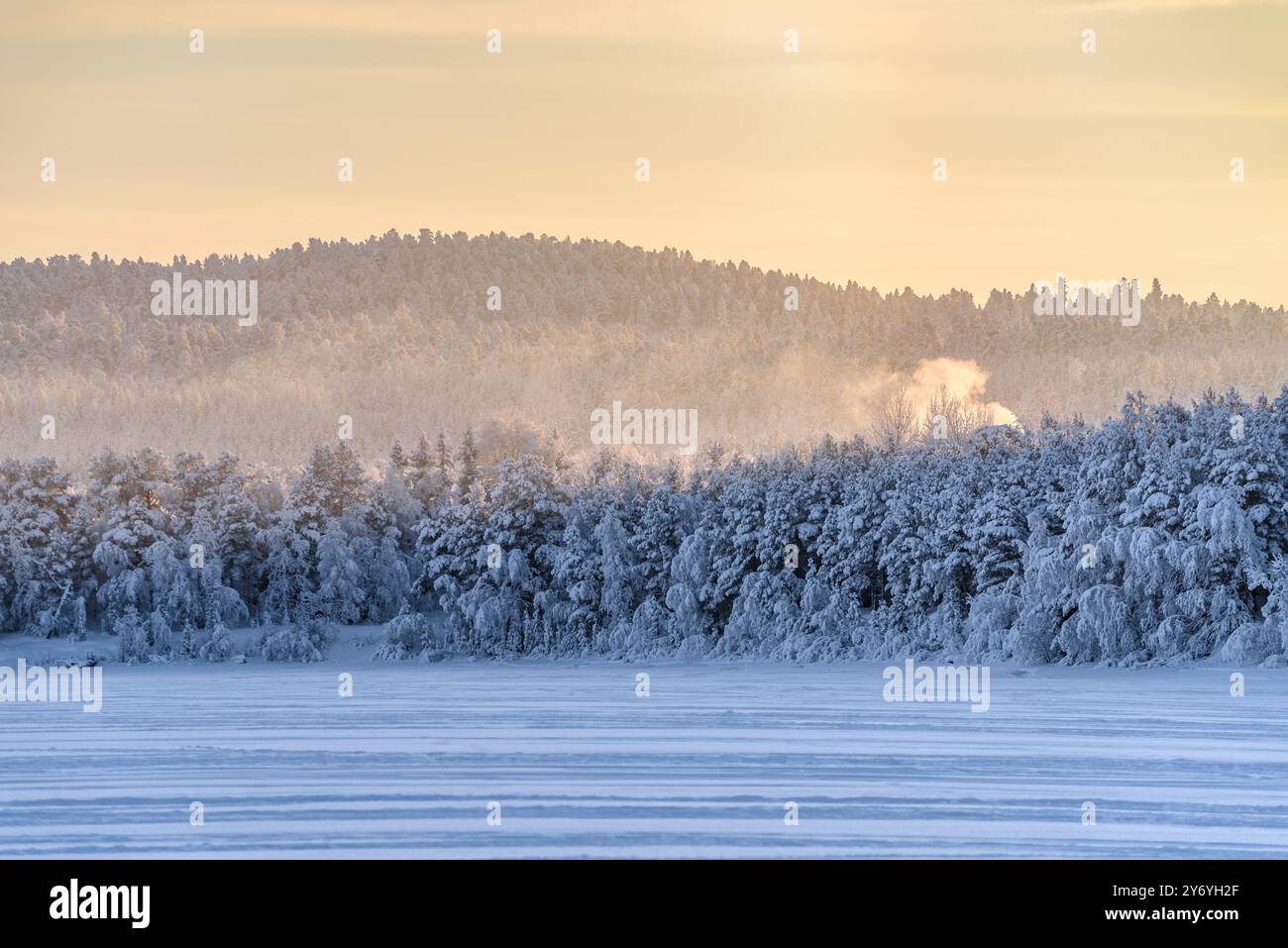 Frozen and snowy Lake Inari in winter, seen at sunset (Lapland, Finland ...