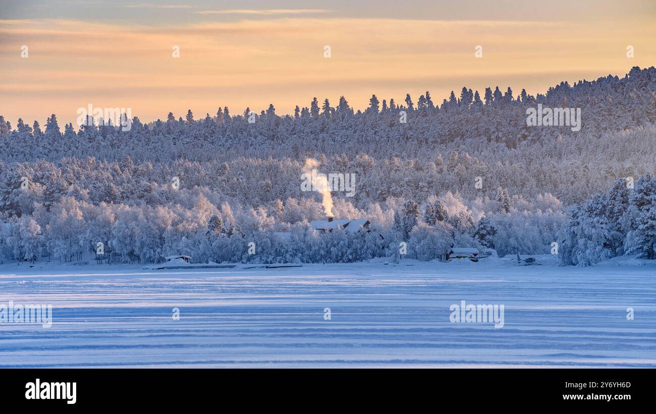 Frozen and snowy Lake Inari in winter, seen at sunset (Lapland, Finland ...