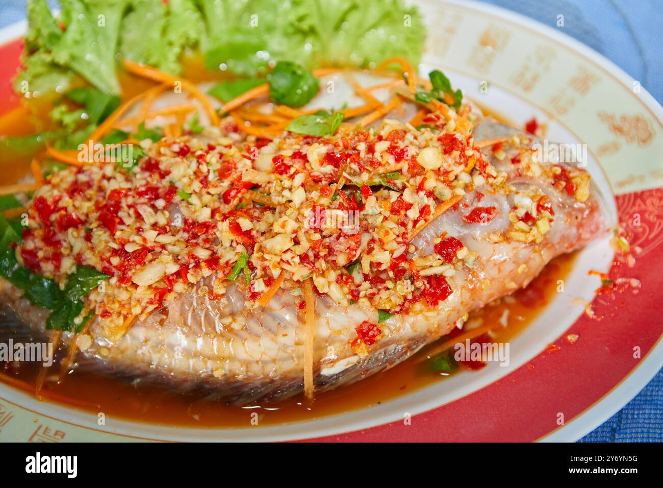 Deep fried snapper with sweet chili sauce in plate Stock Photo - Alamy