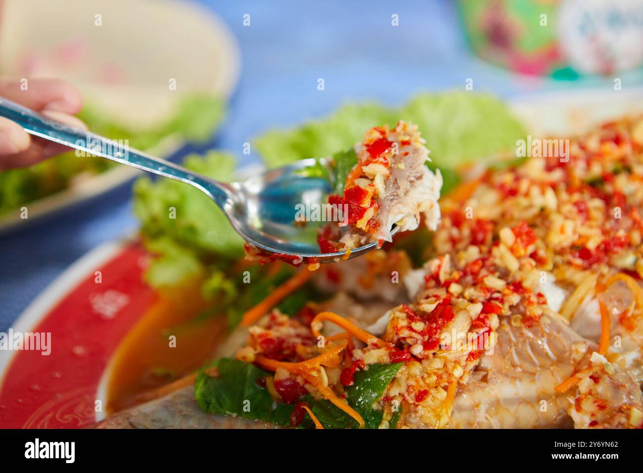Deep fried snapper with sweet chili sauce in plate Stock Photo - Alamy