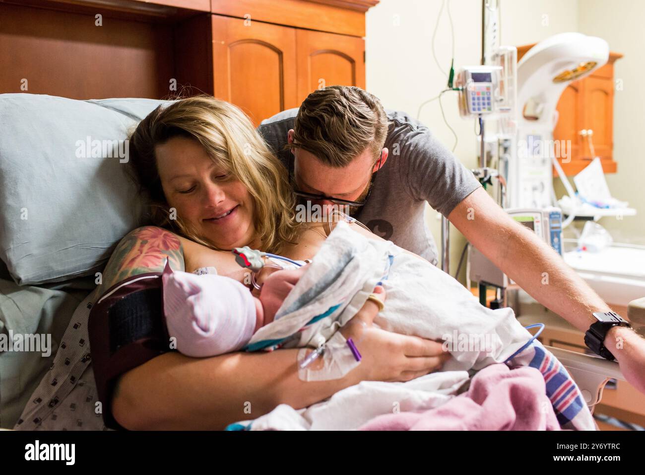 Dad Kisses Mom's Shoulder After She Gives Birth in Hospital Stock Photo ...