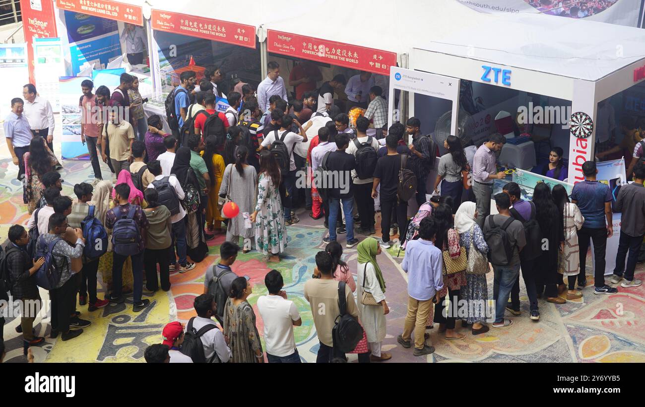 Dhaka. 27th Sep, 2024. People visit stalls during the "Dhaka China Day ...