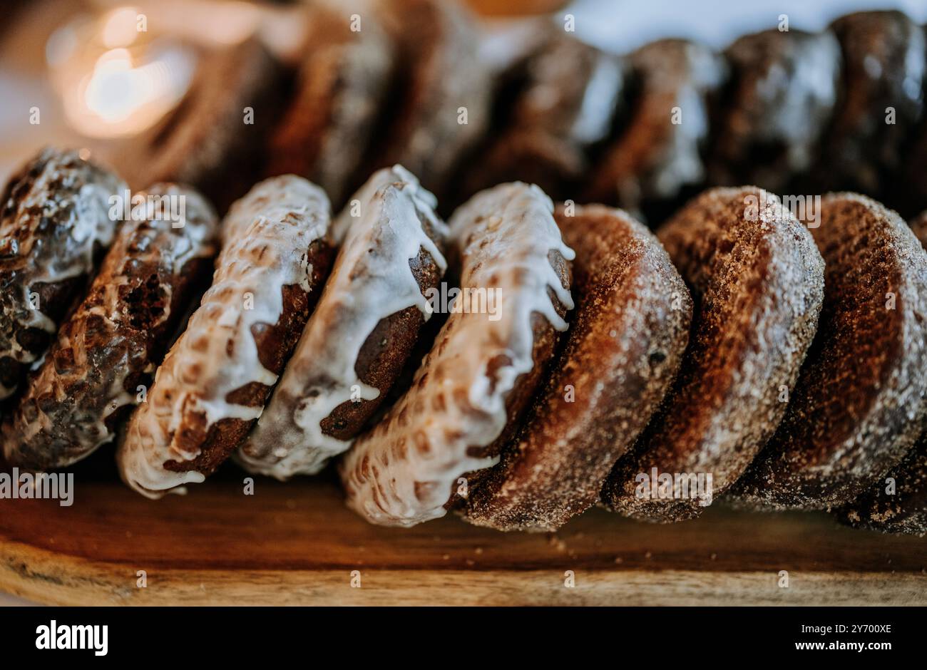 close up of stack of chocolate frosted donuts on a table Stock Photo ...