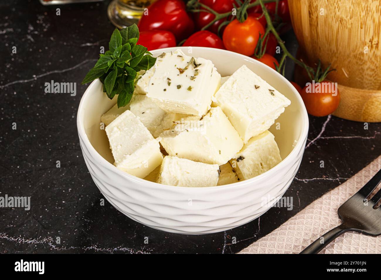 Greek traditional Feta cheese cubes with herbs and spices Stock Photo ...