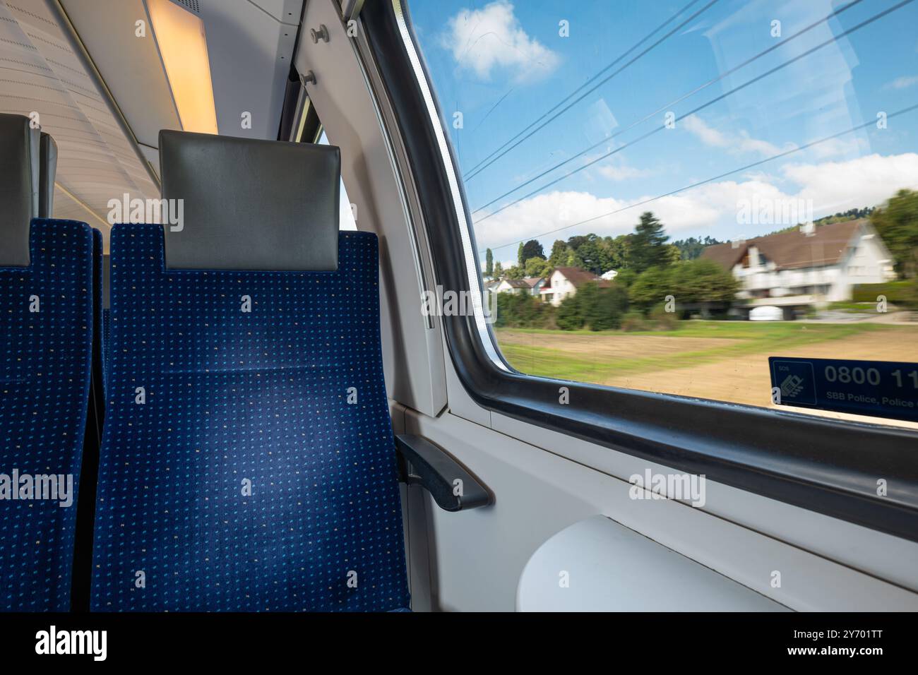 Empty seats in a public passenger train in Switzerland, Europe. Wide ...