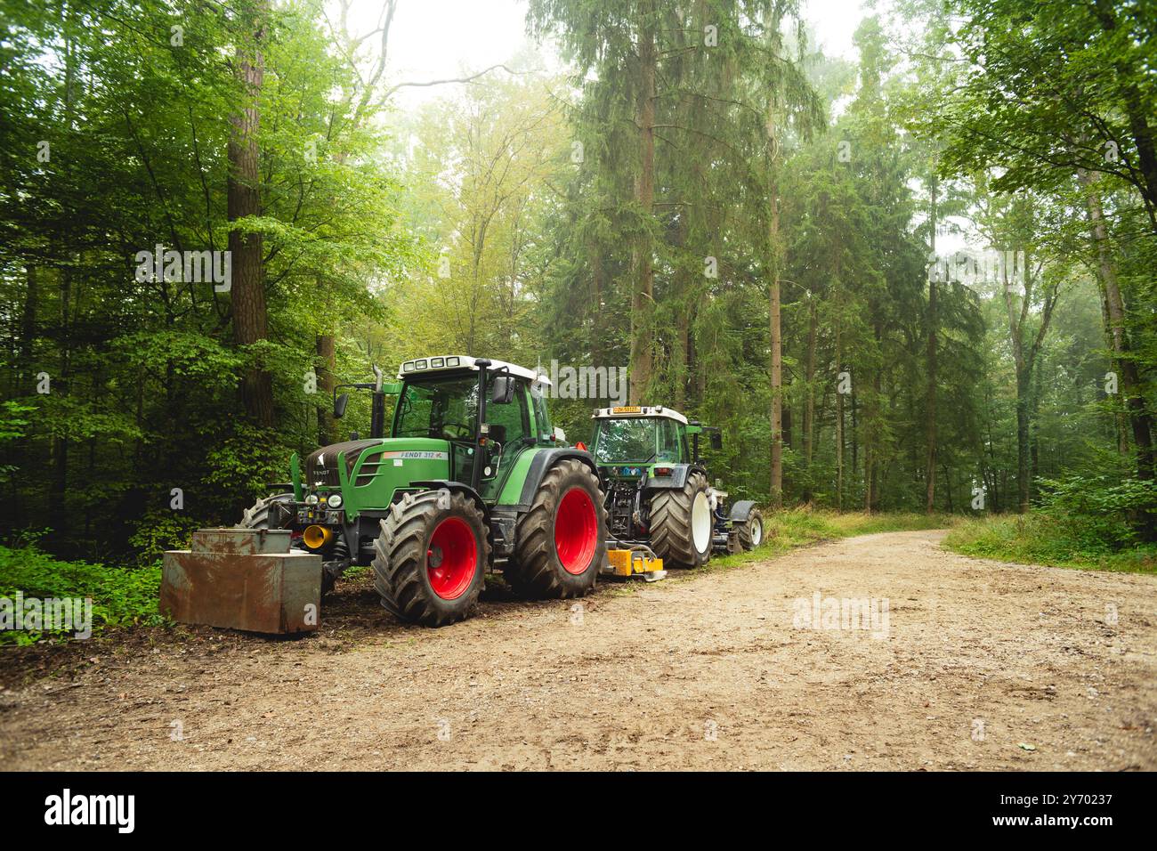 Large forestry work tractors on the side of the road in a European ...