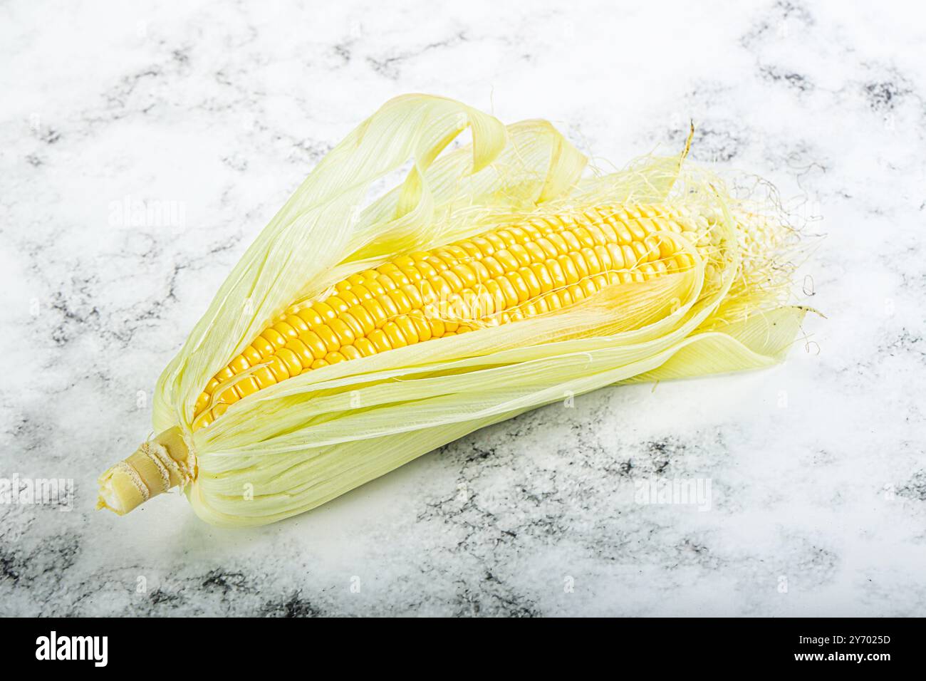 Raw sweet ripe yellow Corn with leaves Stock Photo - Alamy
