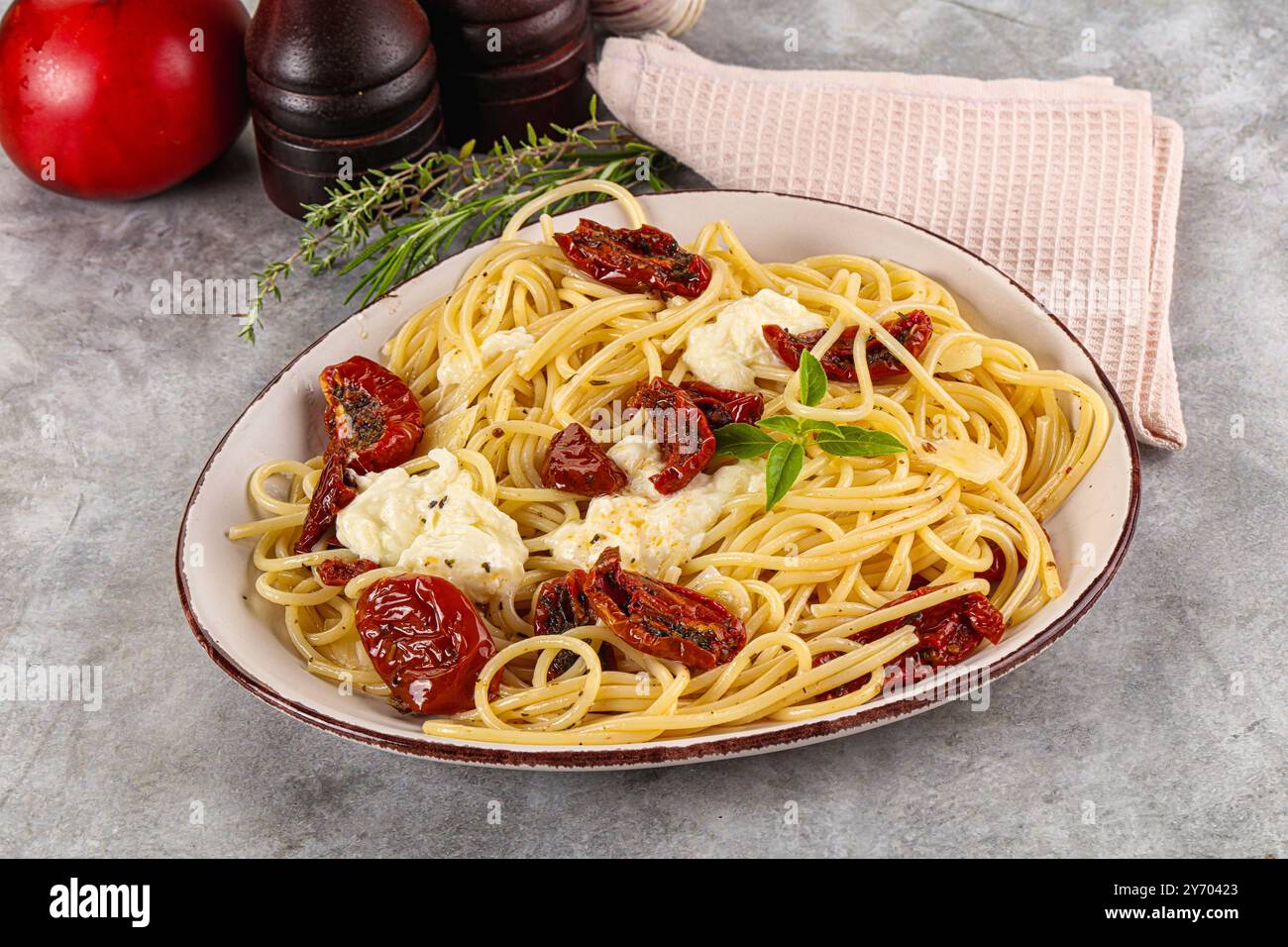 Italian pasta spaghetti with stracciatella and tomato Stock Photo - Alamy