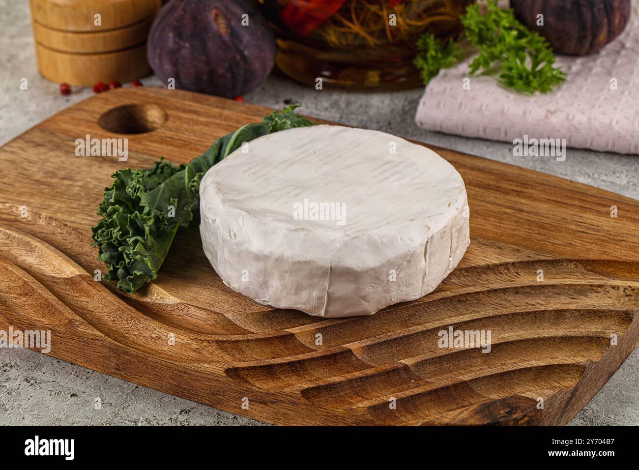 Gourmet round creamy Camembert cheese served fig Stock Photo - Alamy