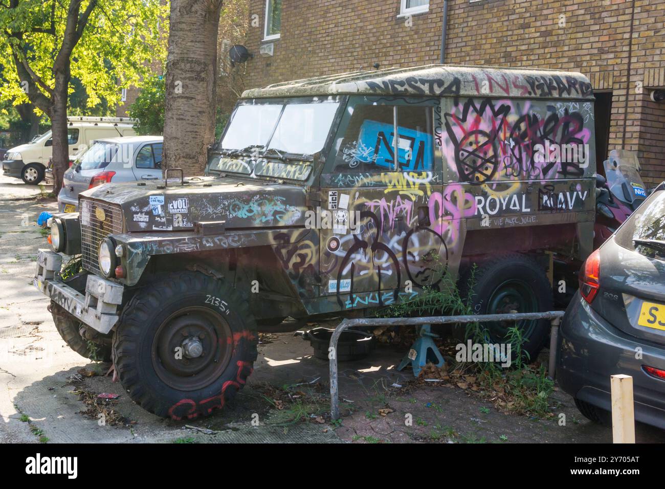 A graffiti covered 1974 Land Rover Defender in Brick Lane, east London ...