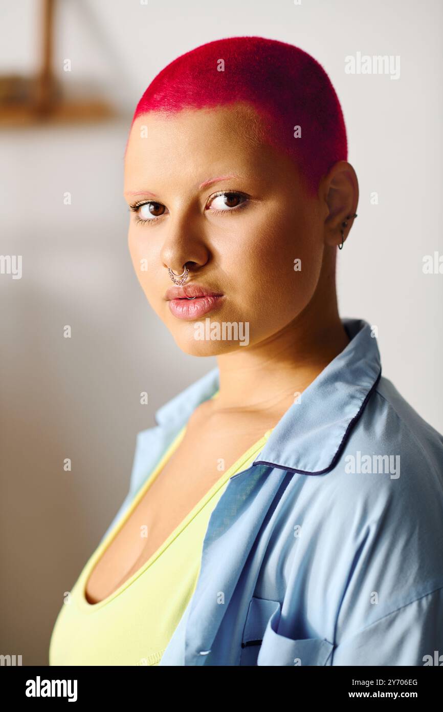 With a striking pink hairstyle, the young woman radiates confidence in ...