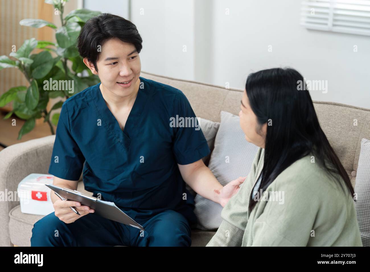 Healthcare Professional Visiting Patient at Home Providing Medical ...