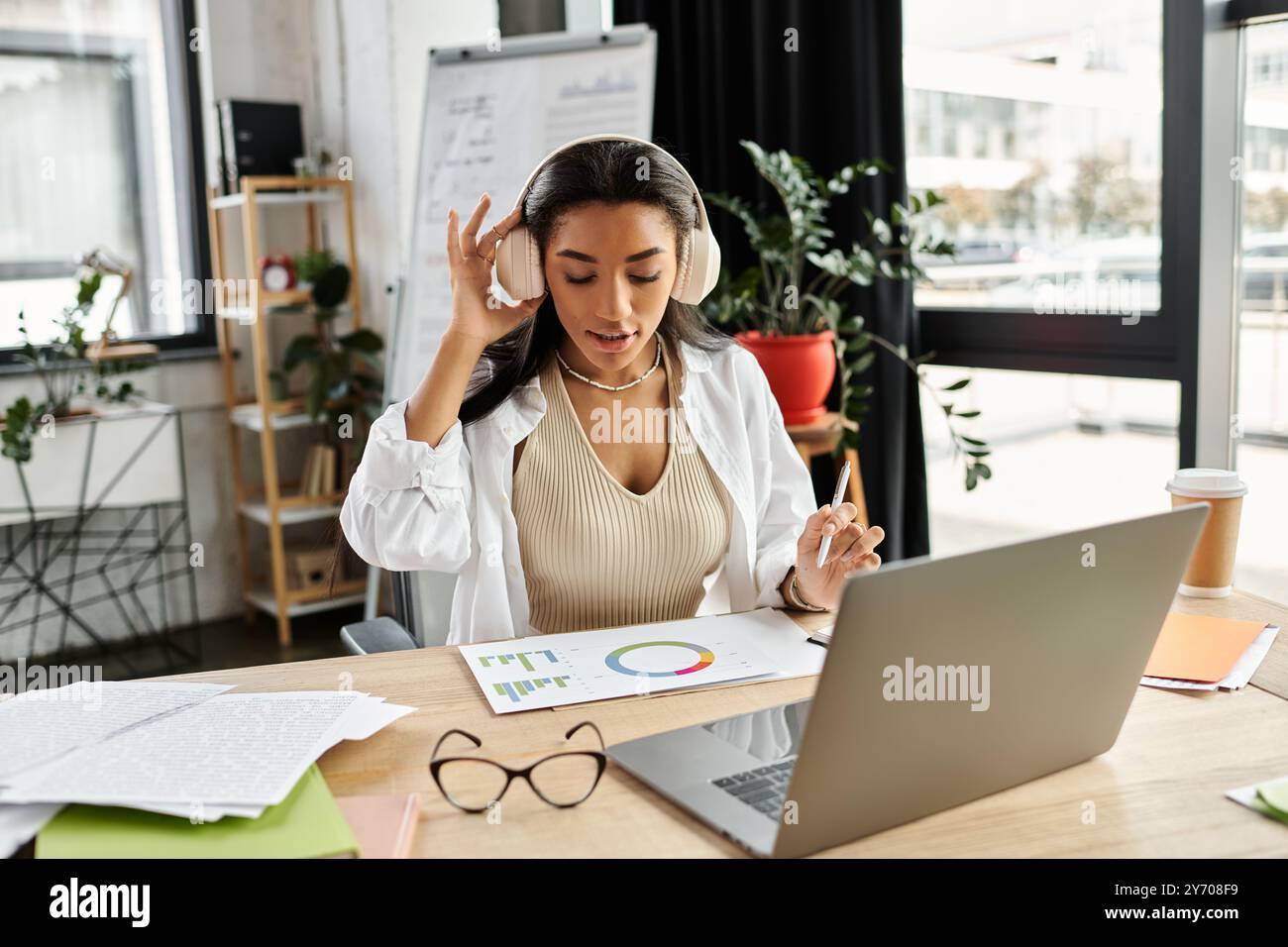Focused woman headphones analyzes hi-res stock photography and images ...