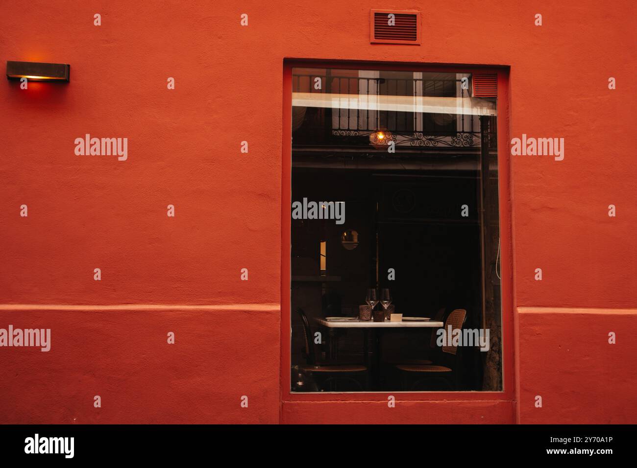 Bloody red facade of building with large window of cafe, restaurant ...