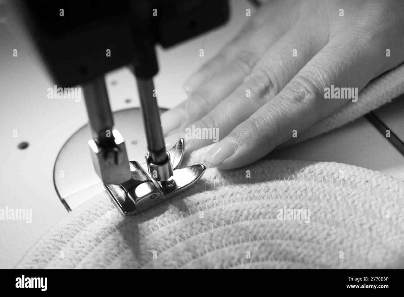 Woman working sewing machine fashion Black and White Stock Photos ...
