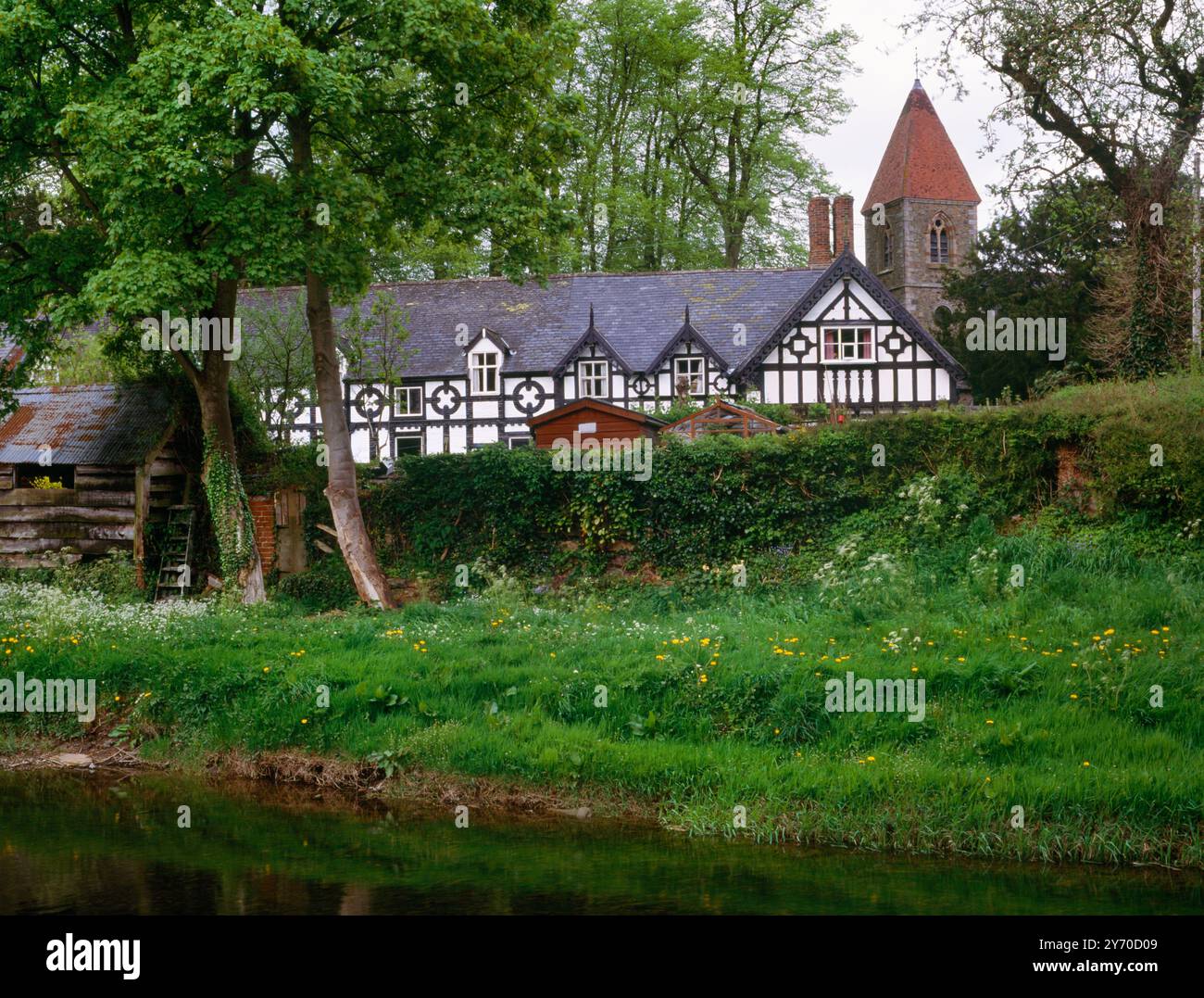 View NE over the River Rhiw & Church Terrace black and white houses to ...