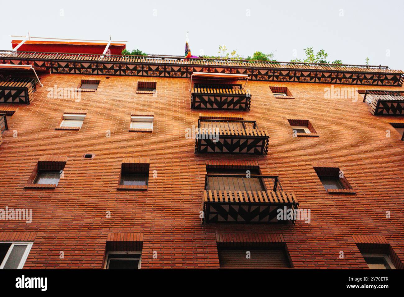 Madrid, Spain. 1 May 2024 Brown brick residential house facade. Urban ...