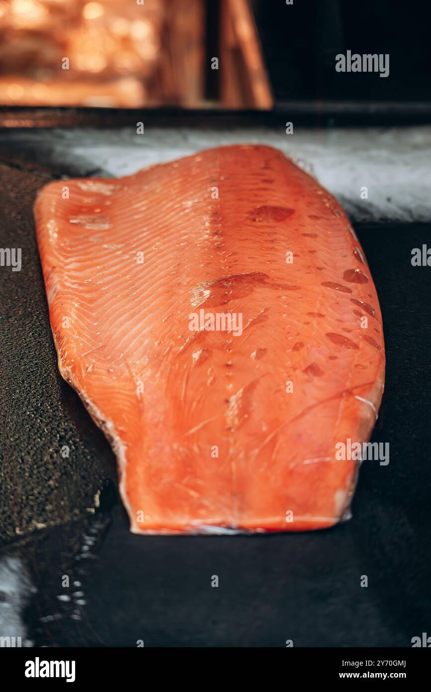 Cut fresh salmon in a fishmonger's display case Stock Photo - Alamy