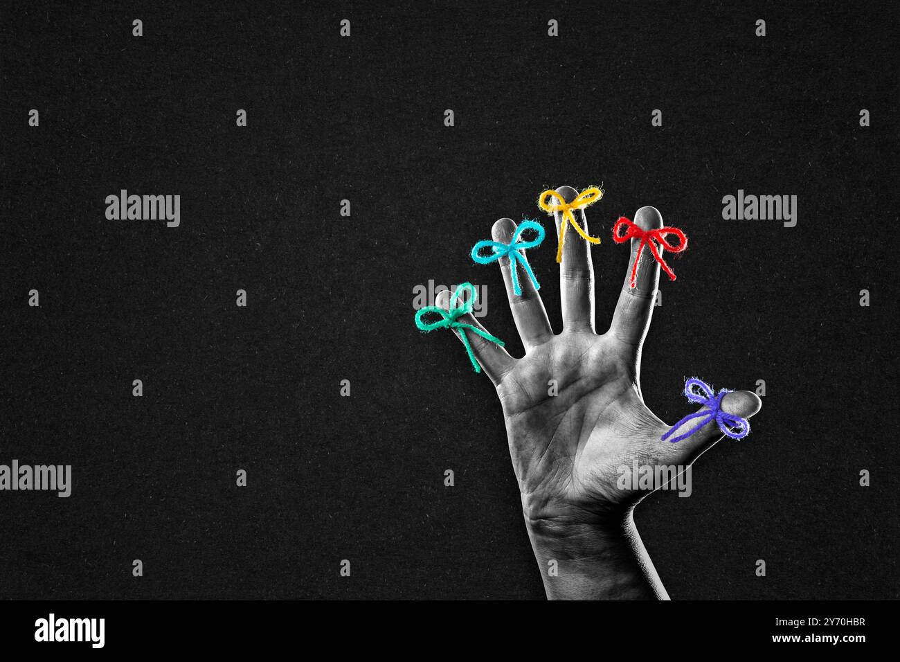 Five Colorful Rope Bows on Fingers Reminder Sign in Black and White on ...