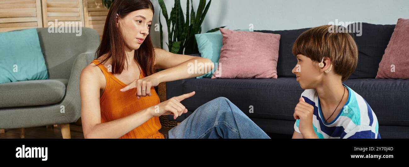 A mother uses sign language to communicate with her son, fostering ...