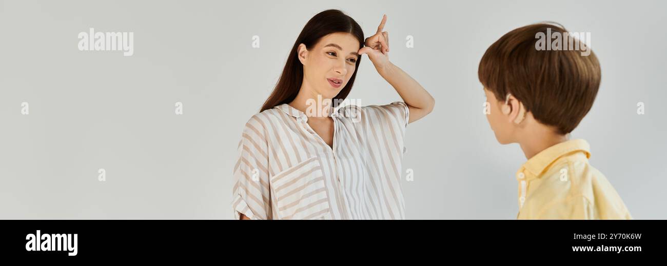 A mother and her little boy share a heartfelt moment, communicating ...