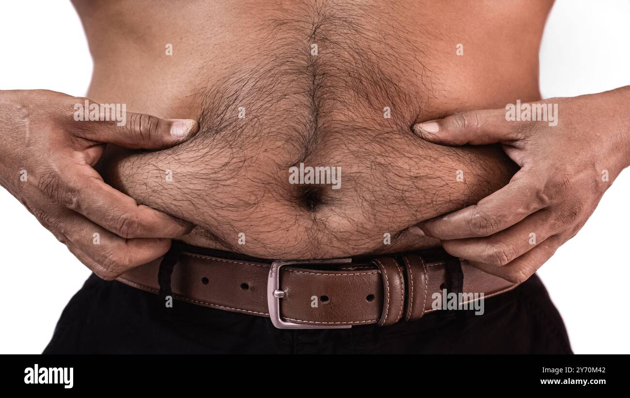 Man assessing his belly fat problem. Overweight man standing and show ...