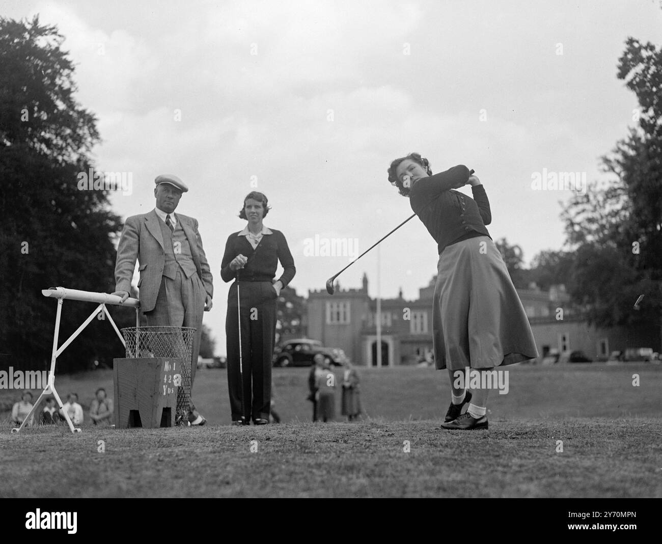 Miss . M. WALLIS , watched by Miss F. Stephens. august 11 1949 Stock ...