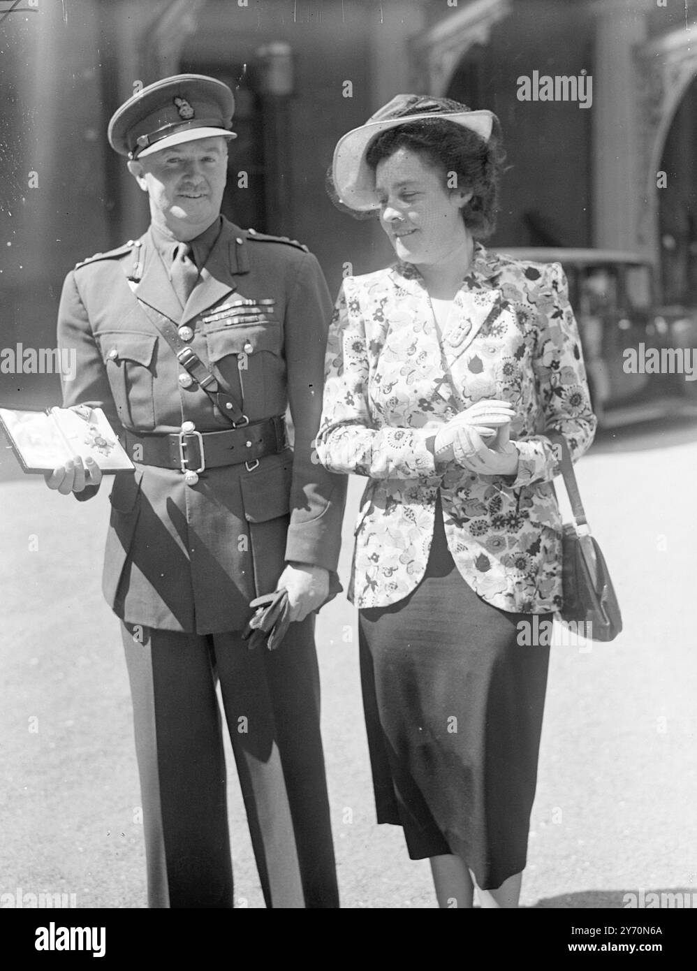C.B.E. FOR BRIGAGIER AT INVESTITURE Brigadier GUY ROUTLEDGE showing the ...