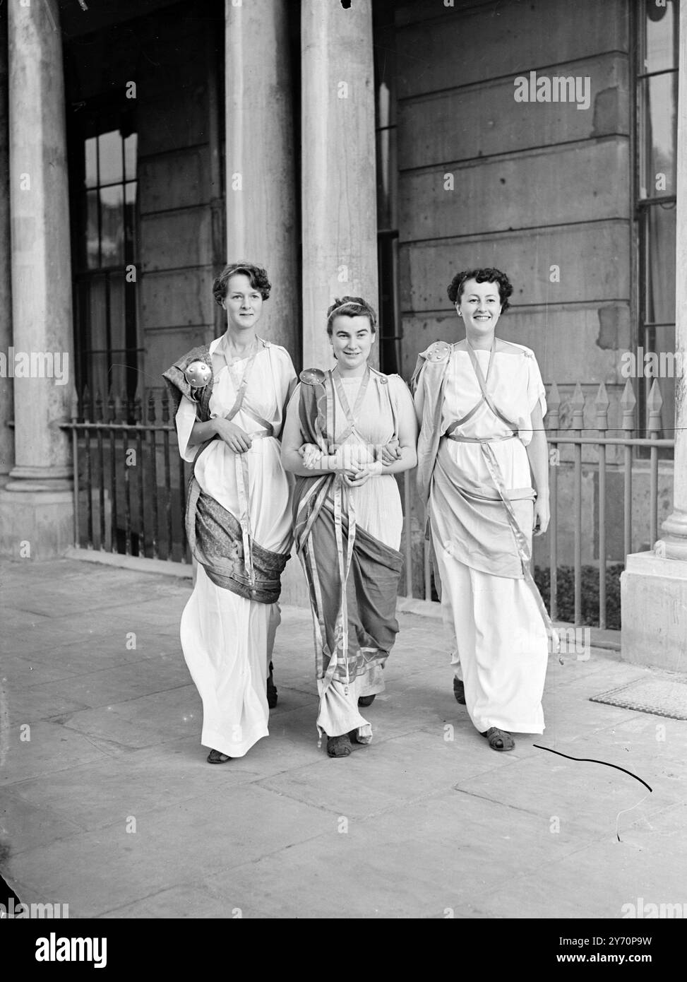 GREEK TO THE ' ERKS ' ! Flowing Grecian robes, in sharp contrast with ...