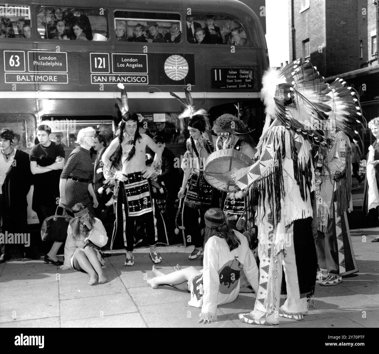 POW WOW IN KING'S ROAD London : Passengers on a No.11 bus stare in ...