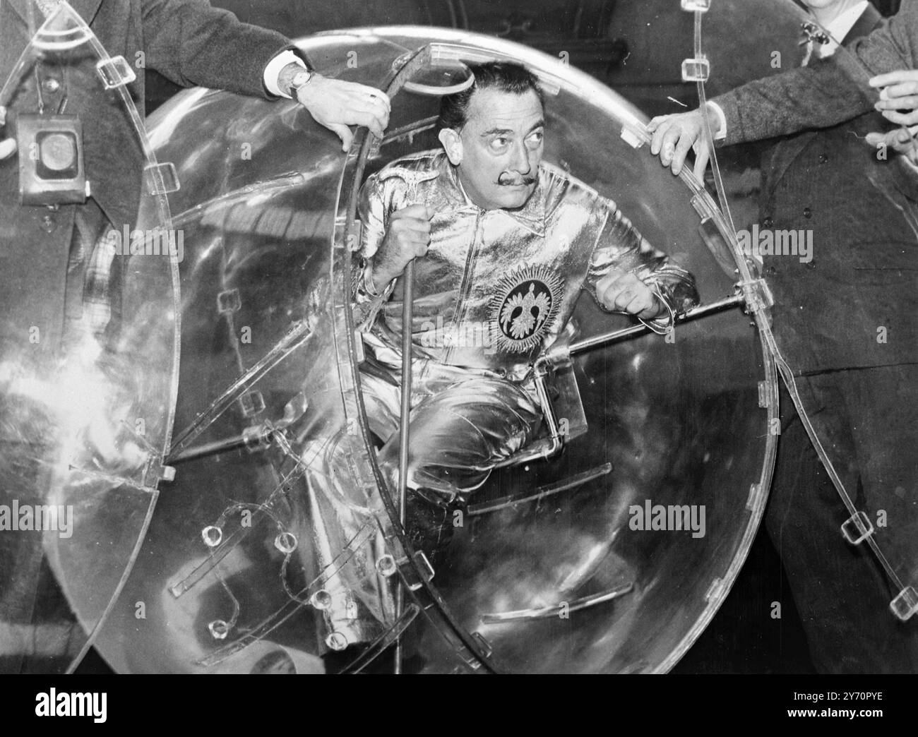 Salvador Dali prepares to be closed into his Ovocipede. A transport ...