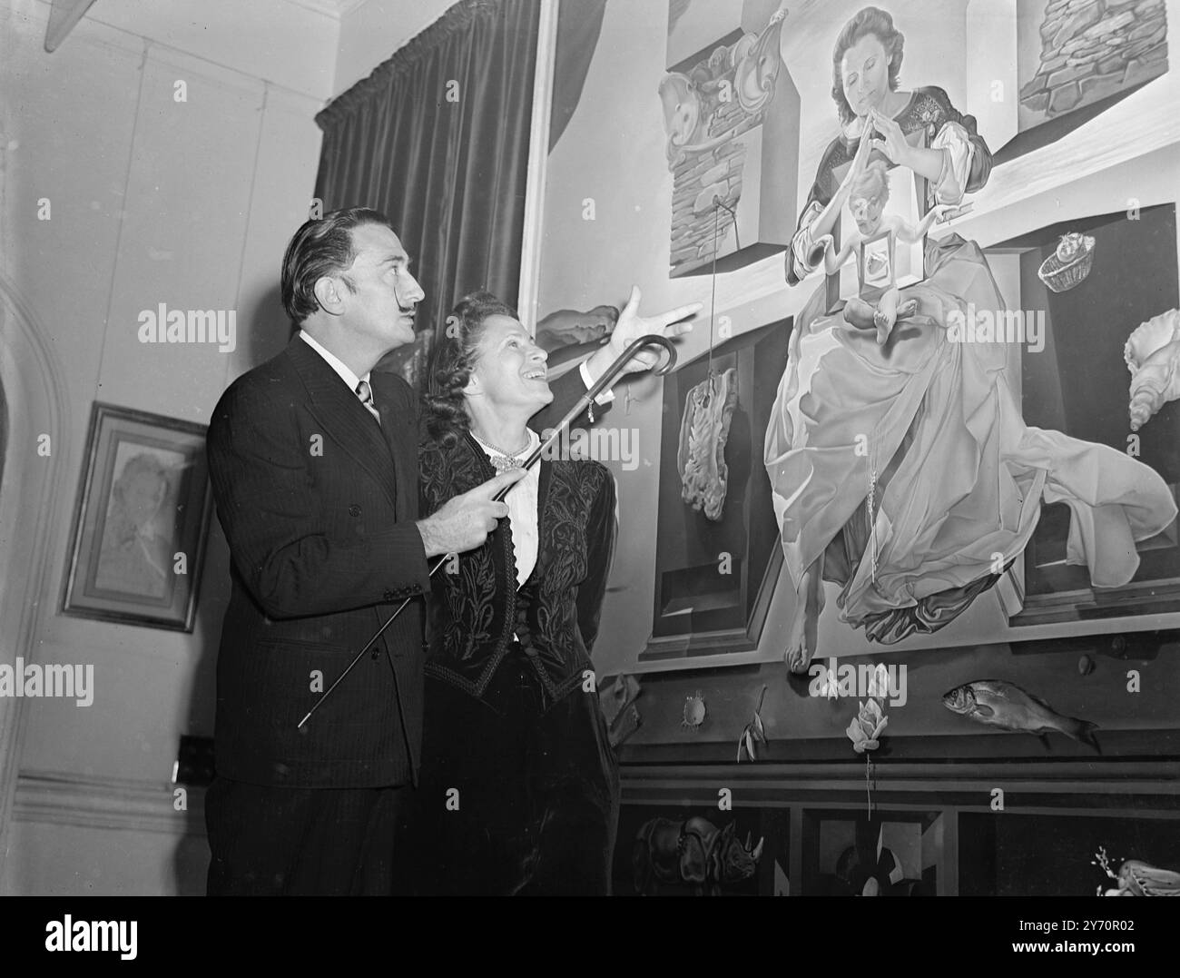 Salvador Dali discusses with his wife Gala his painting The Madonna of ...