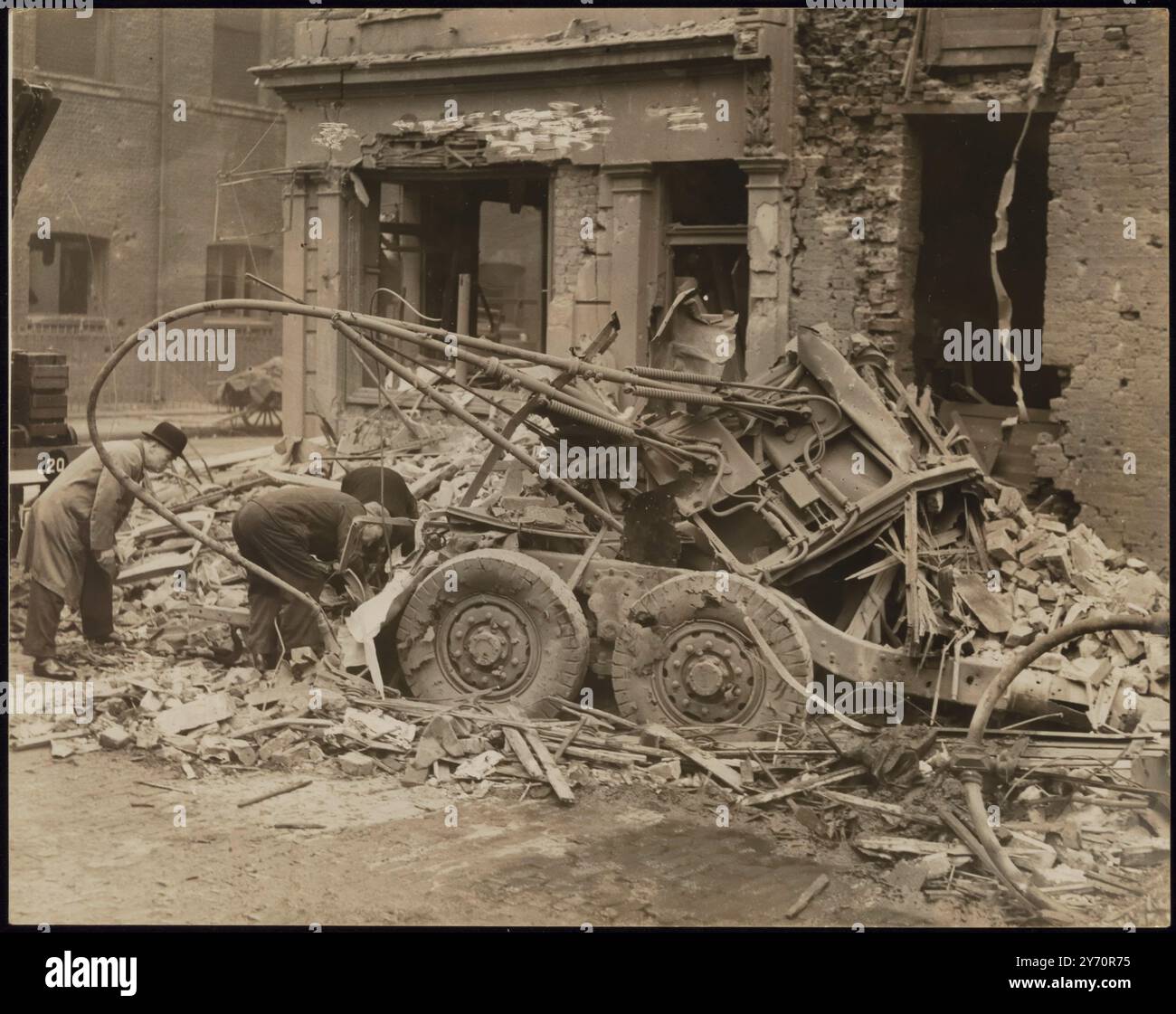 BUS WRECKED BY BOMB.PHOTO SHOWS:- A trolley-bus which was wrecked by a ...
